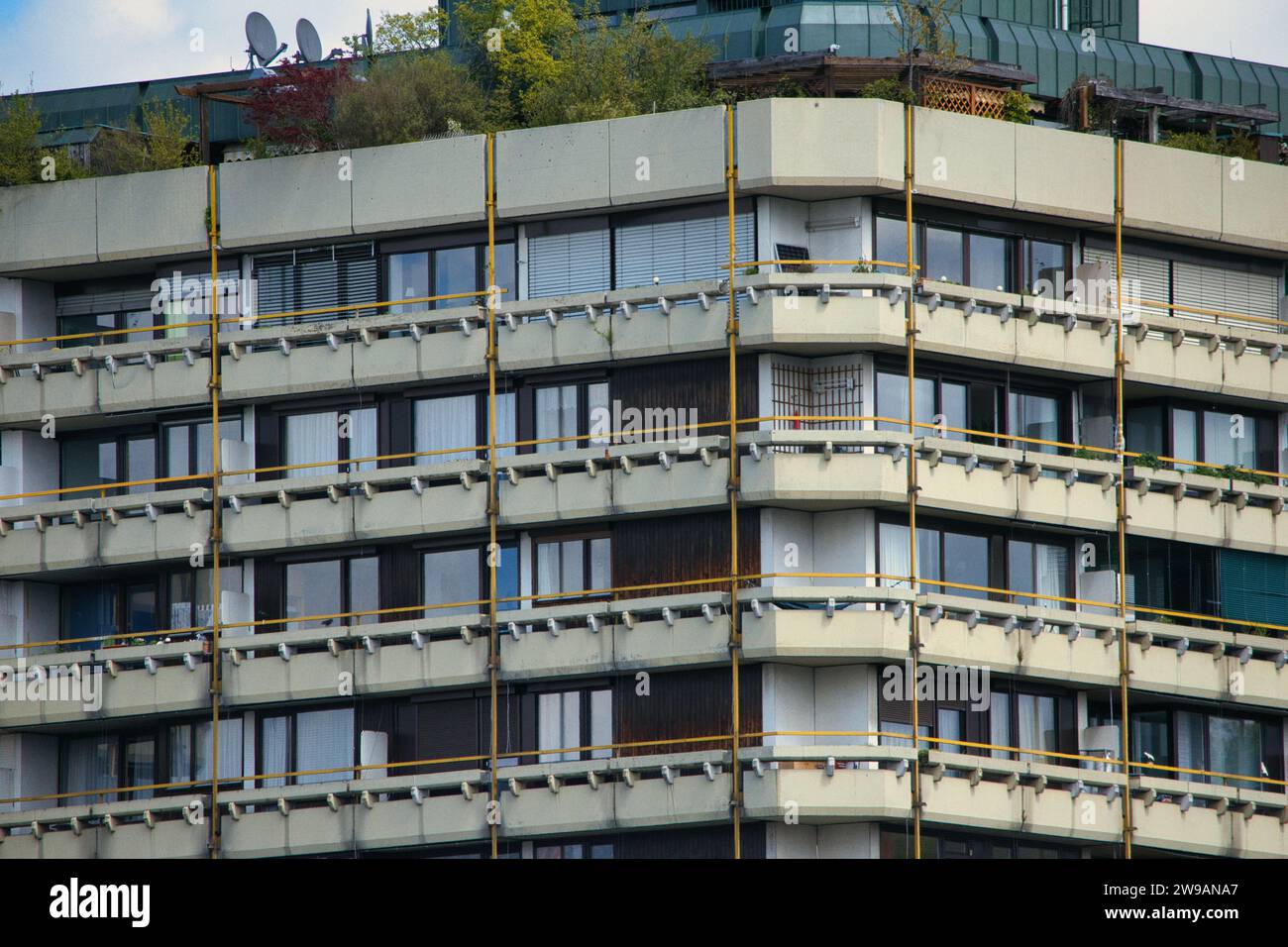 A stunning view of a 70s-era apartment building facade in the beautiful ...