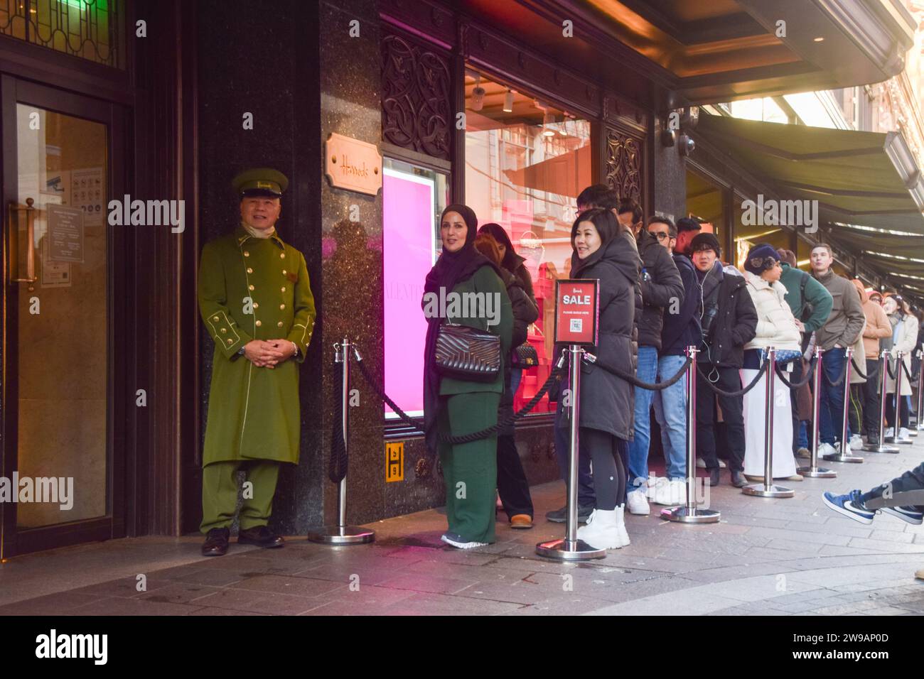 London, England, UK. 26th Dec, 2023. Customers queue outside Harrods in ...