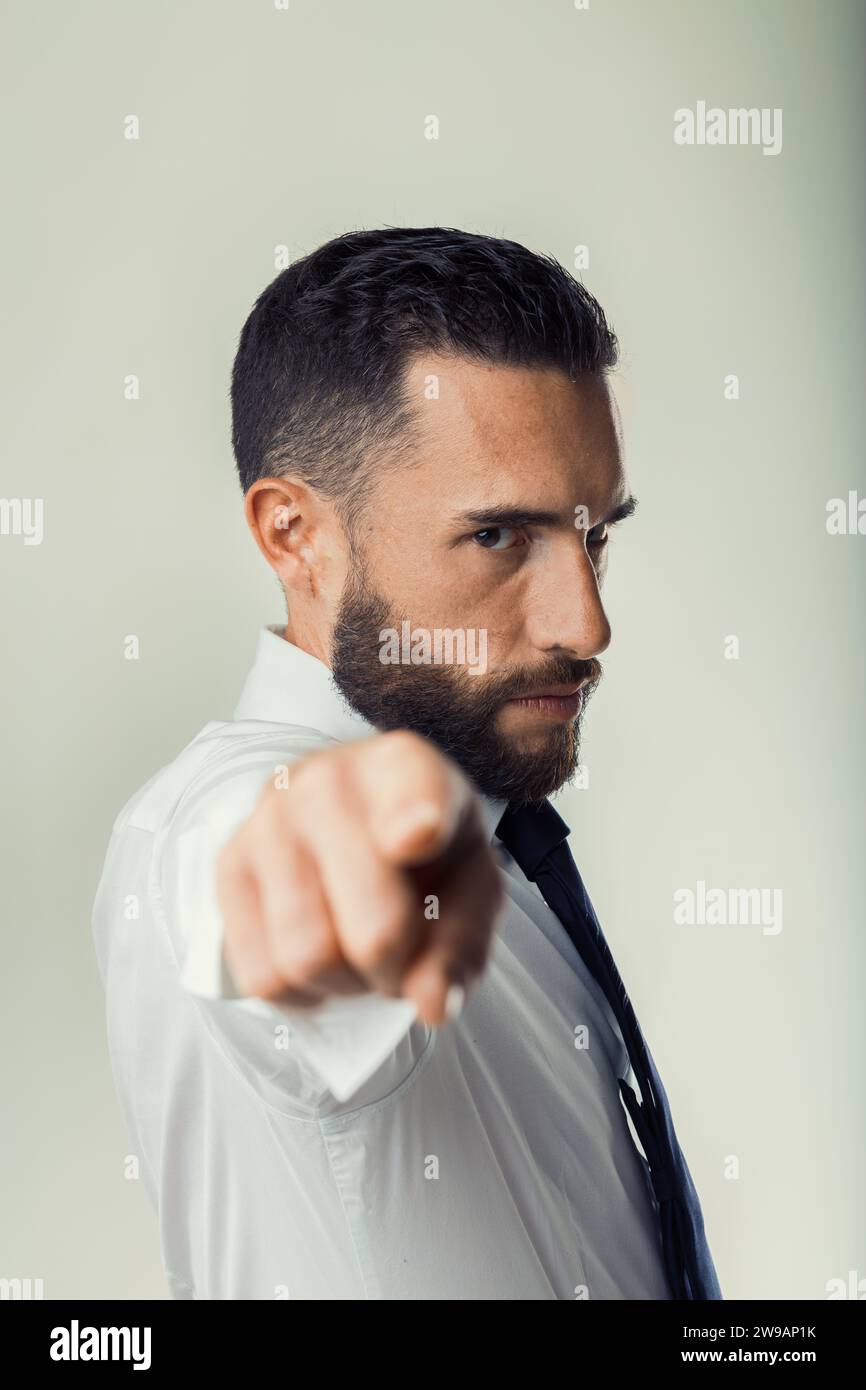 Business attire, commanding direction shown Stock Photo - Alamy