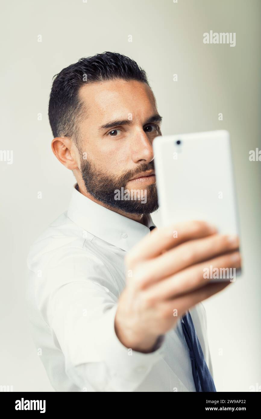 Man in formal attire demonstrates the importance of internet ...