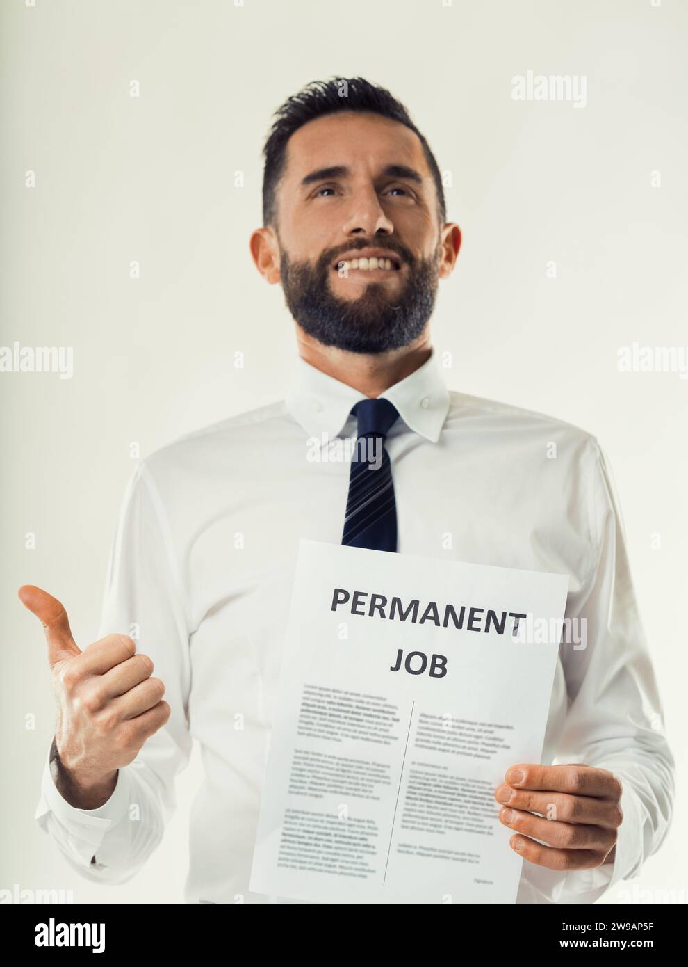 Jubilant professional celebrates securing a permanent job position ...