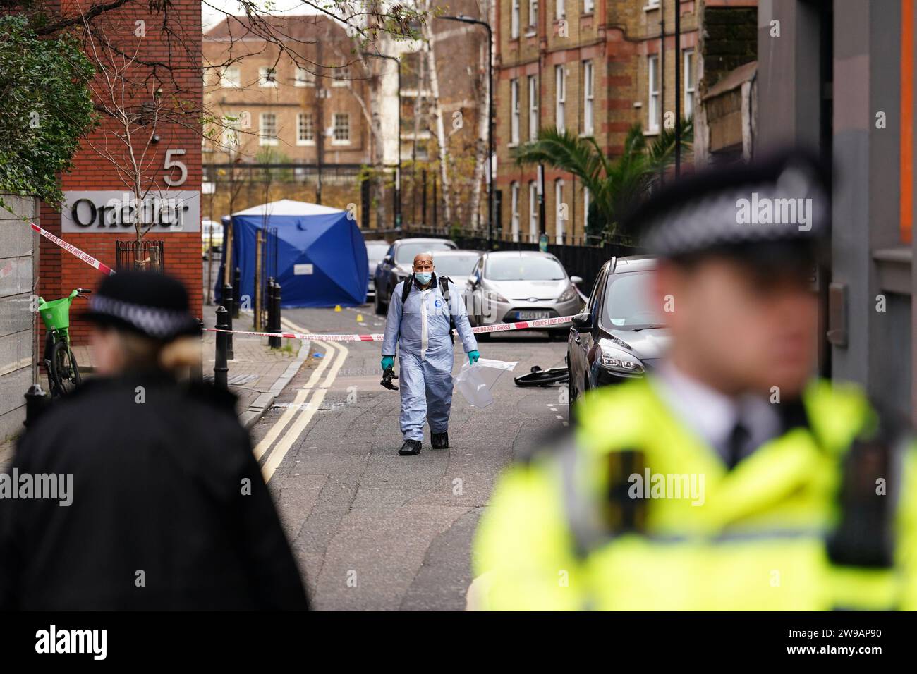 A police forensic officer at a property in Cranwood Street, central ...