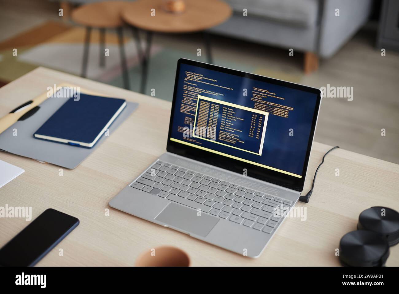 High angle background image of open laptop with code lines on screen at ...