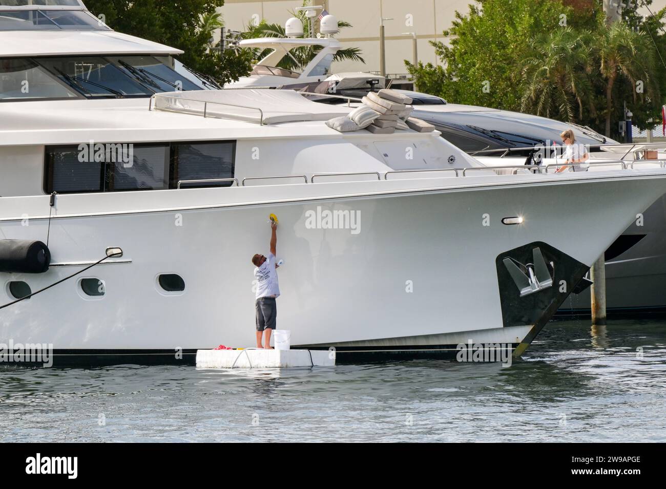 Fort Lauderdale, Florida, USA - 2 December 2023: Crew member polishing ...