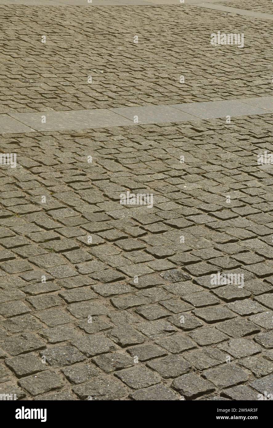The texture of the paving slab (paving stones) of many small stones of ...