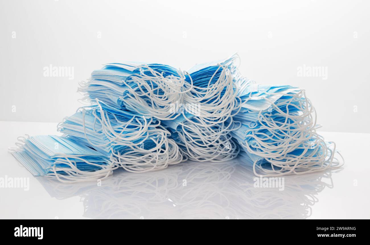 Packs of medical surgical masks on white background Stock Photo - Alamy