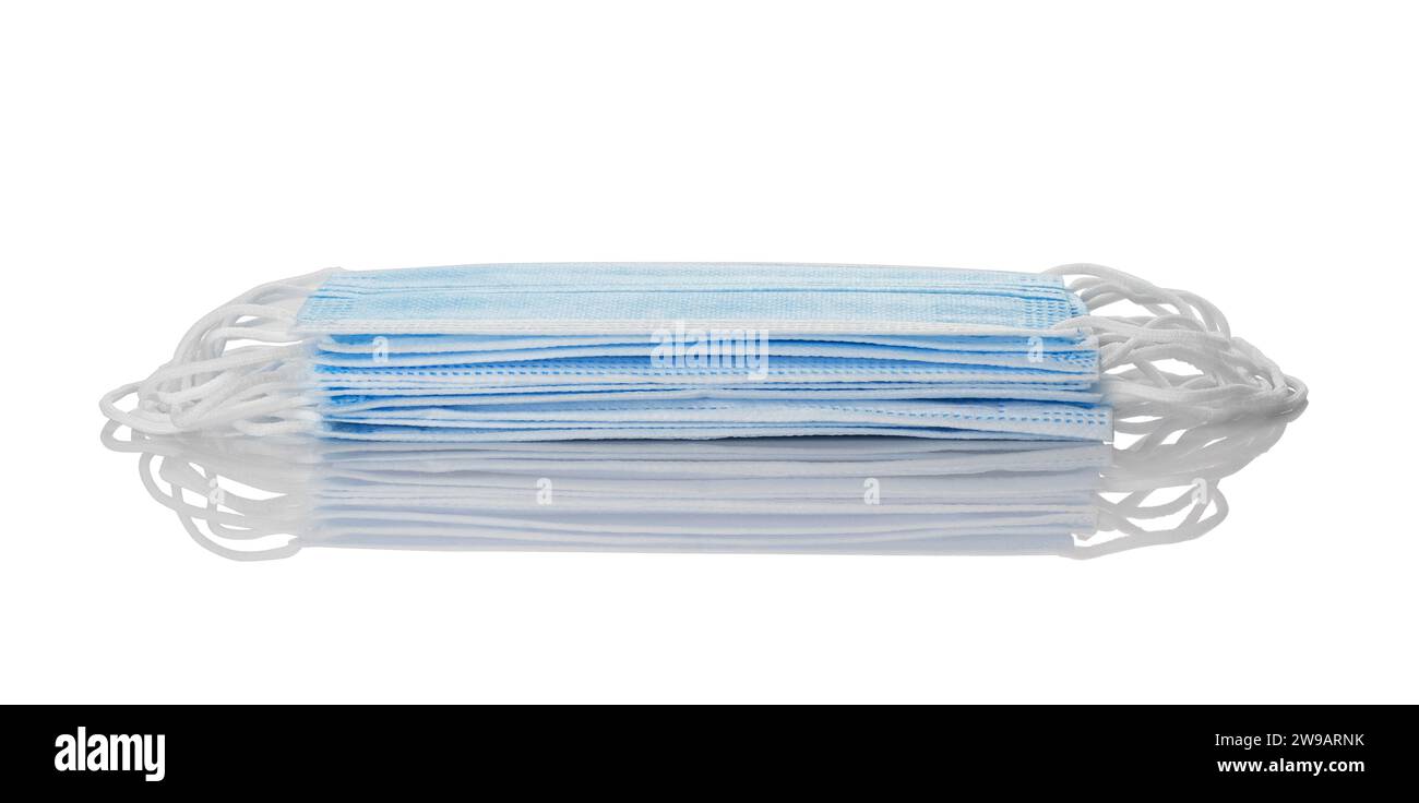 Stack of surgical face masks on a white background. Virus protection ...