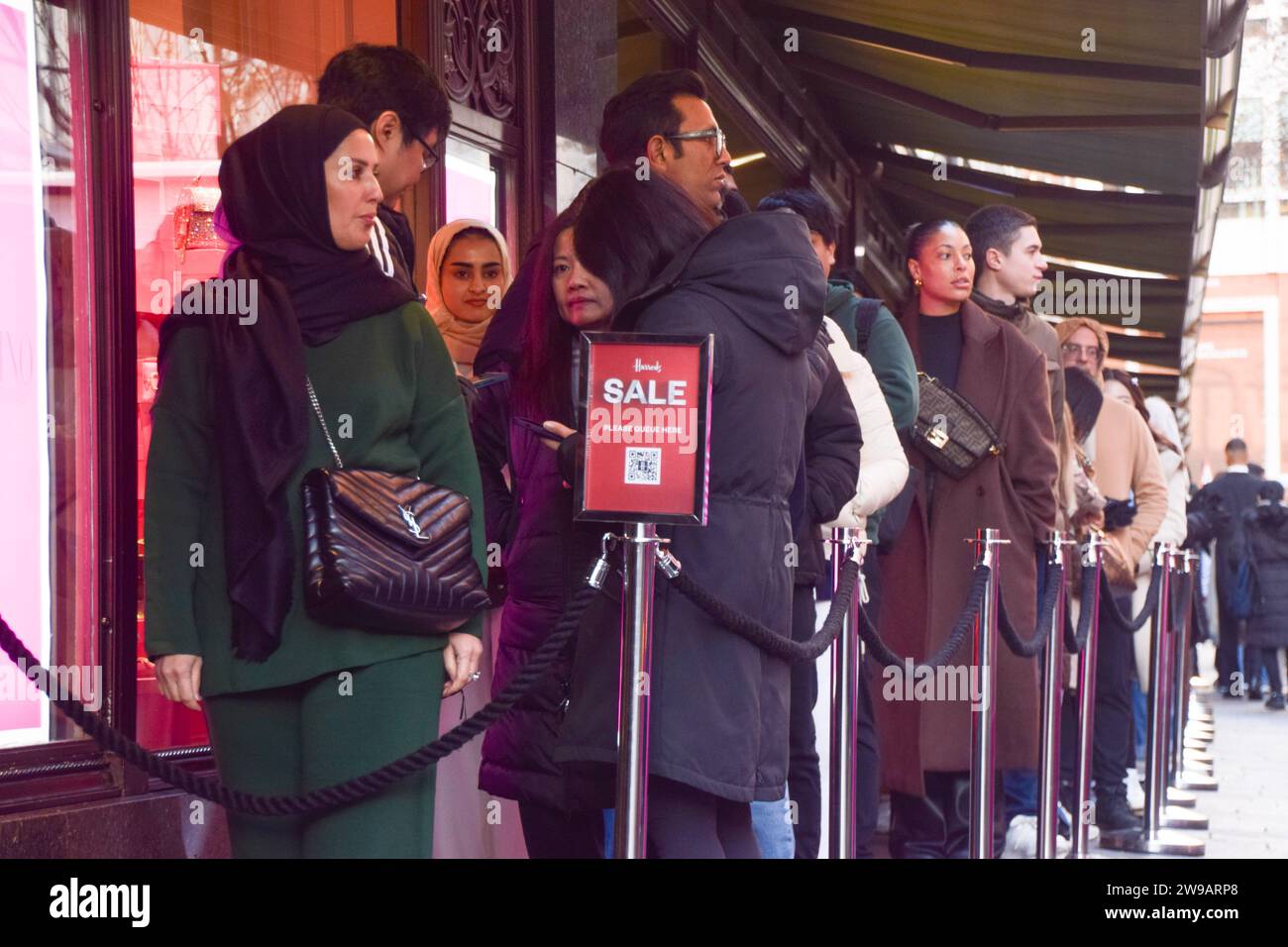 London, England, UK. 26th Dec, 2023. Customers queue outside Harrods in ...
