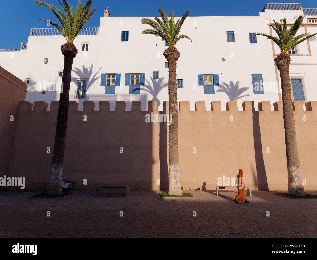 Man walks past houses hi-res stock photography and images - Alamy