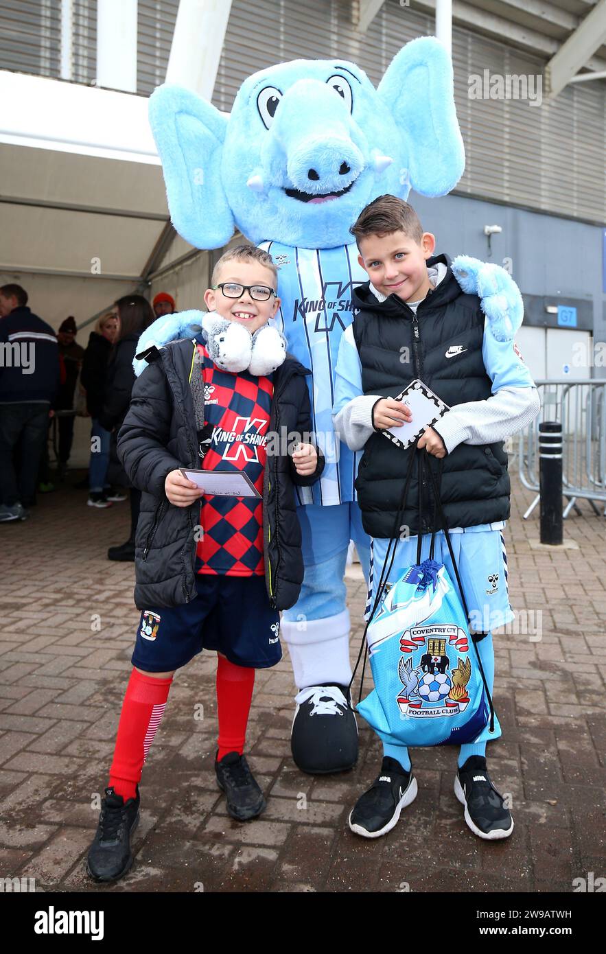 Coventry City fans pose with mascot Sky Blue Sam outside the stadium ...