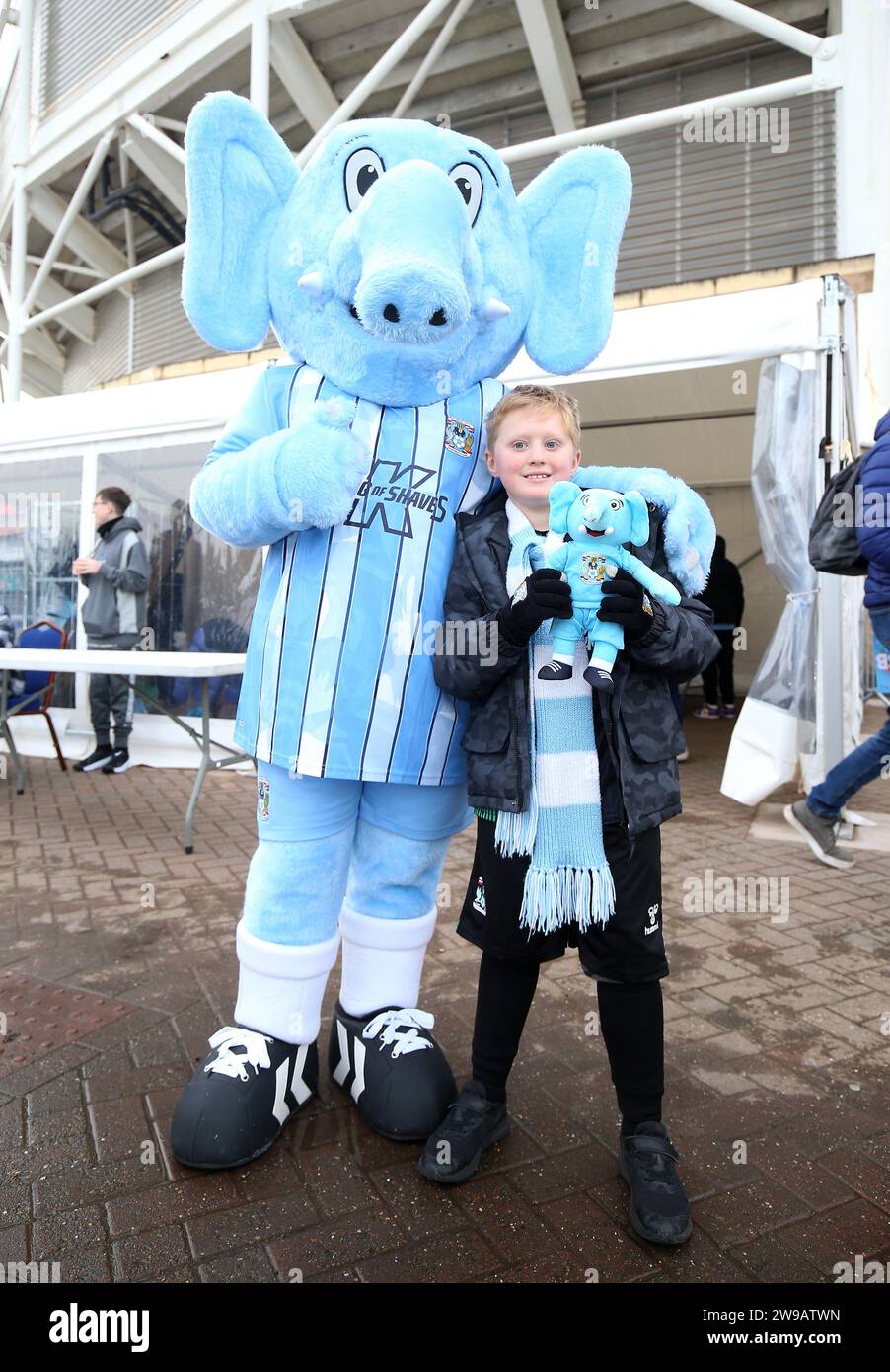 Coventry City fans pose with mascot Sky Blue Sam outside the stadium ...