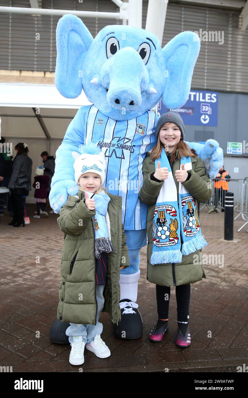 Coventry City fans pose with mascot Sky Blue Sam outside the stadium ...