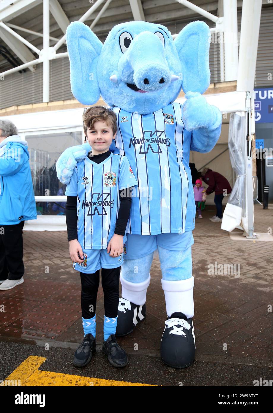 Coventry City fans pose with mascot Sky Blue Sam outside the stadium ...