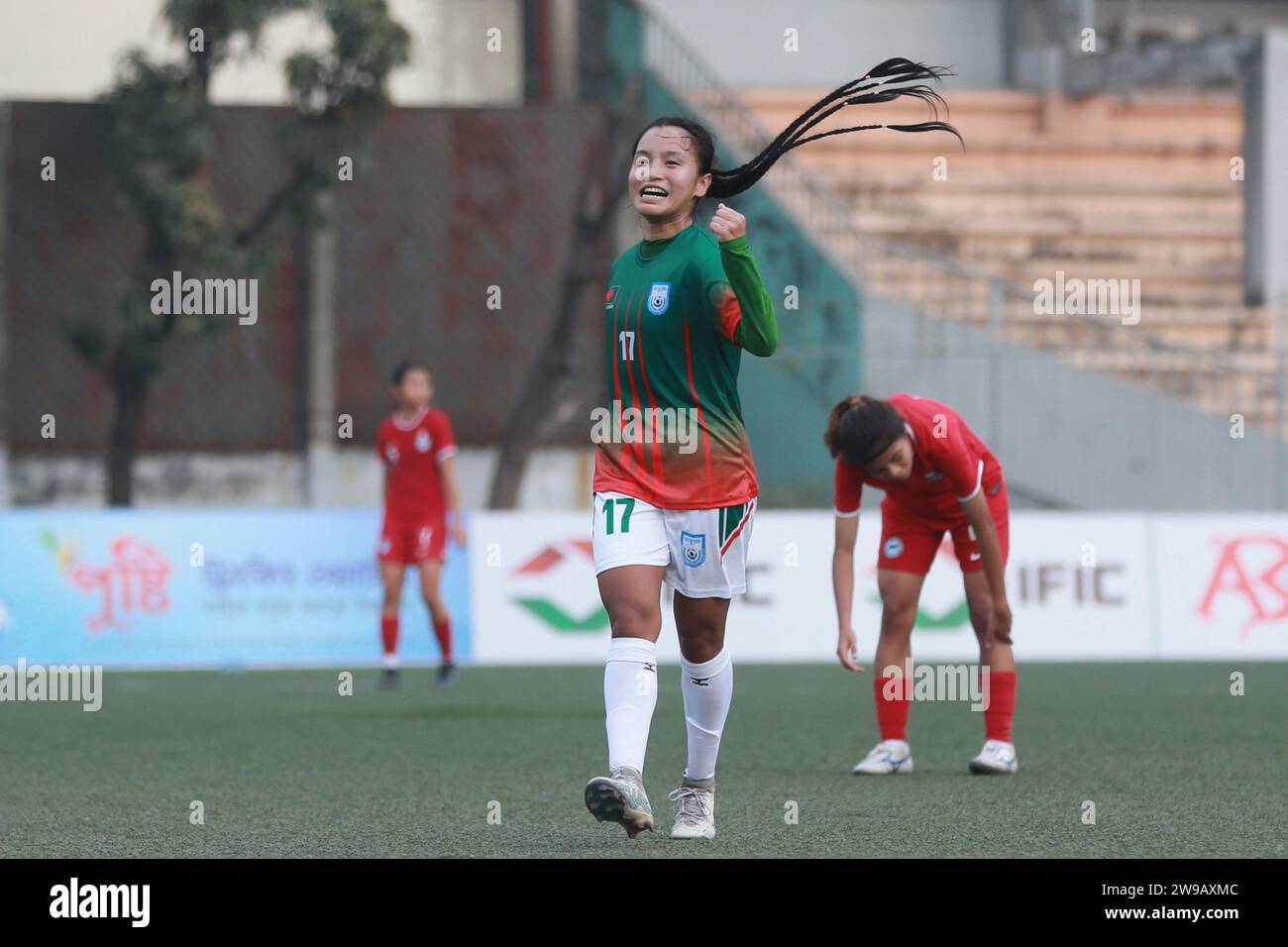 Bangladeshi midfielder Ritu Porna Chakma (Green) celebrates after score ...
