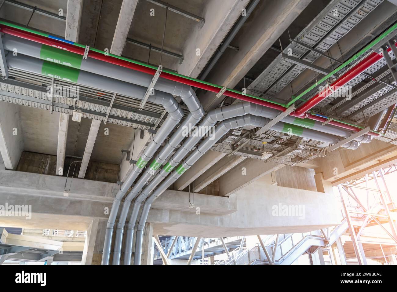 Pipes of various diameters of communication under the ceiling of a ...