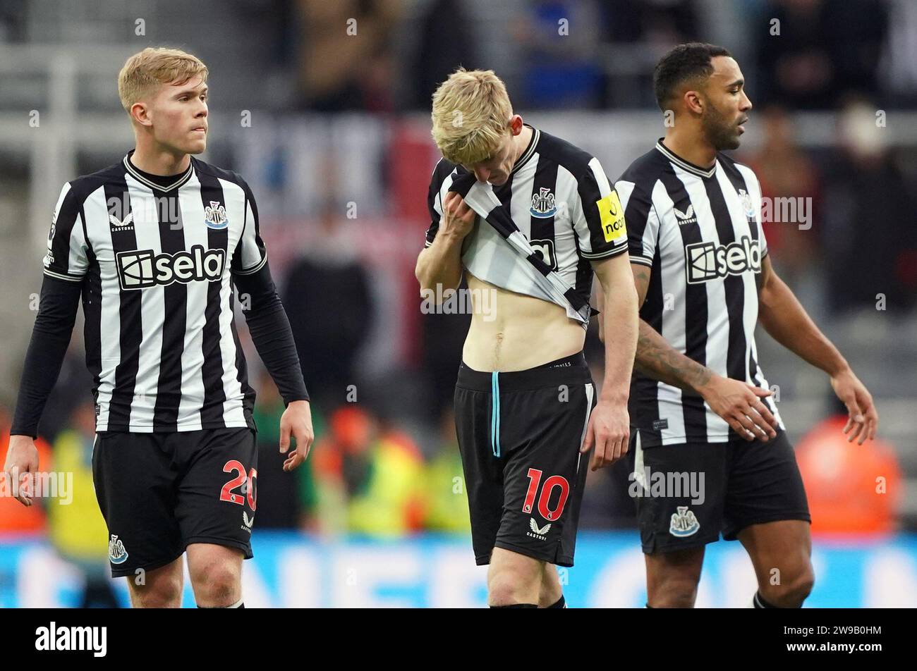 Newcastle United's Lewis Hall, Anthony Gordon and Callum Wilson stand ...