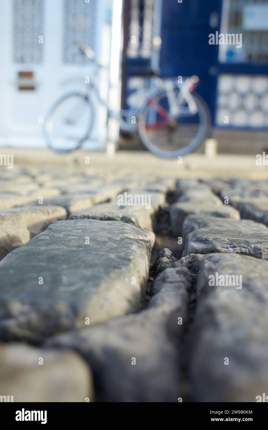 Old Pavement. Close up of old gray pavement with bike in blured on ...