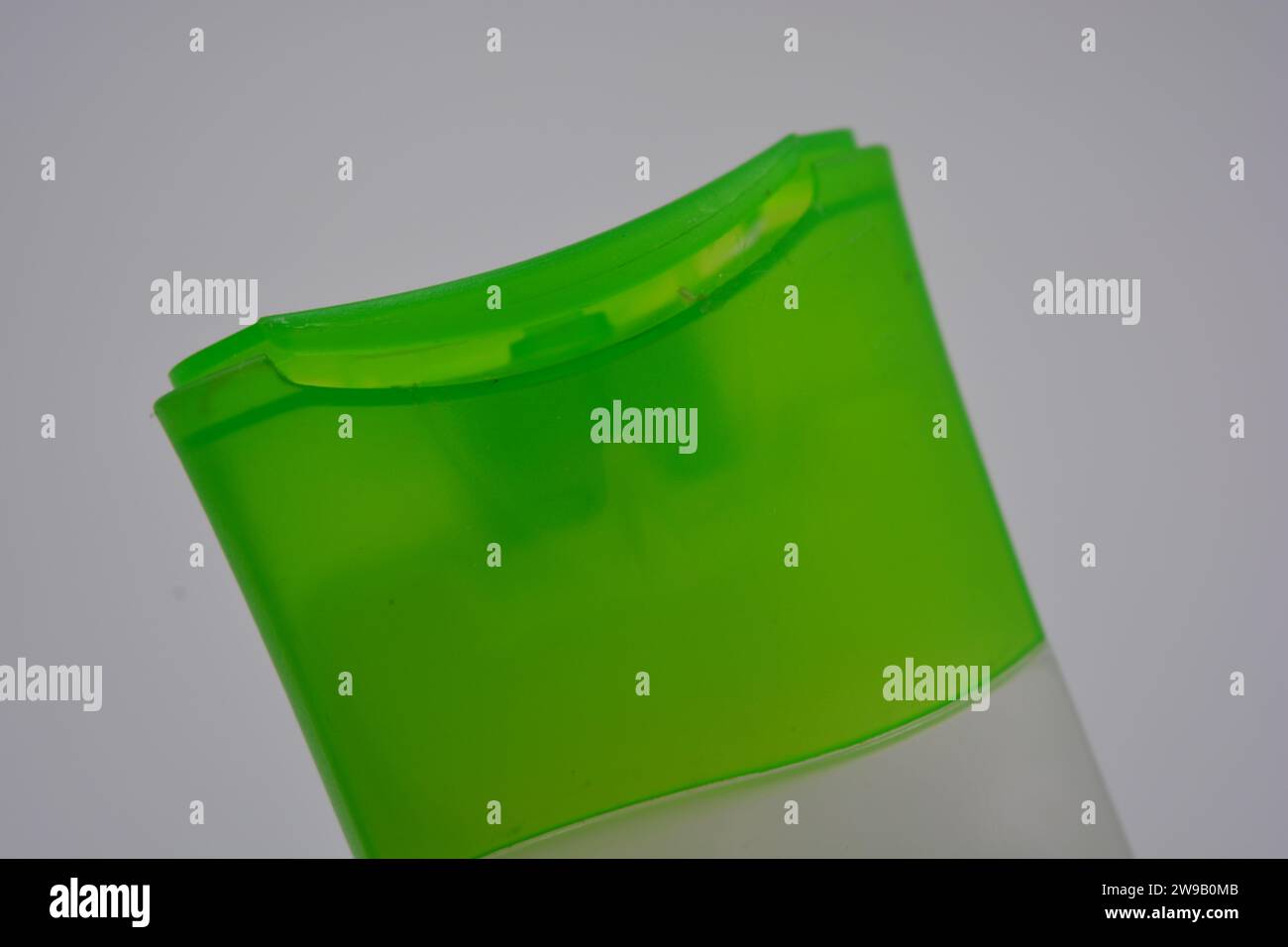 Hygiene products, clear plastic bottle with green plastic cap with ...