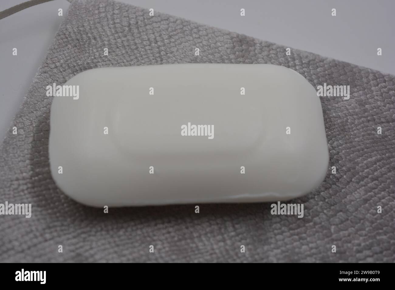 Beautiful, stylish, white bar of soap without logo and name placed on a ...
