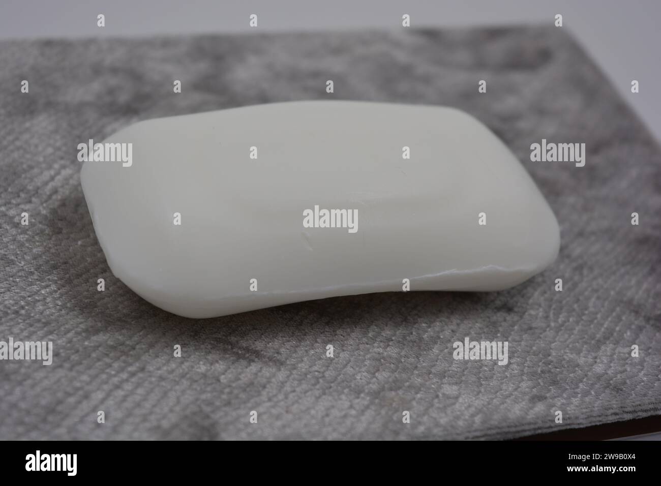 Beautiful, stylish, white bar of soap without logo and name placed on a ...