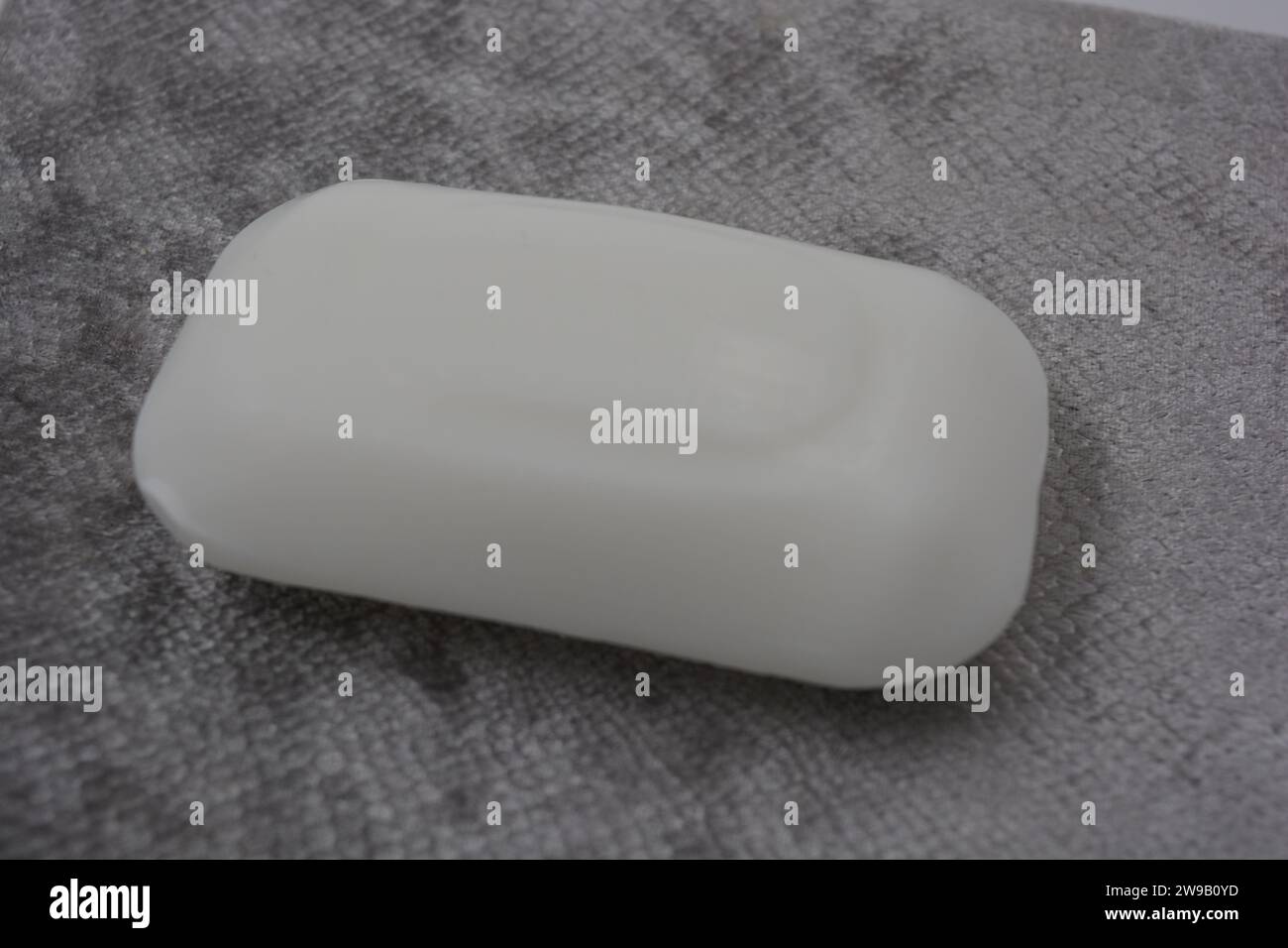 Beautiful, stylish, white bar of soap without logo and name placed on a ...