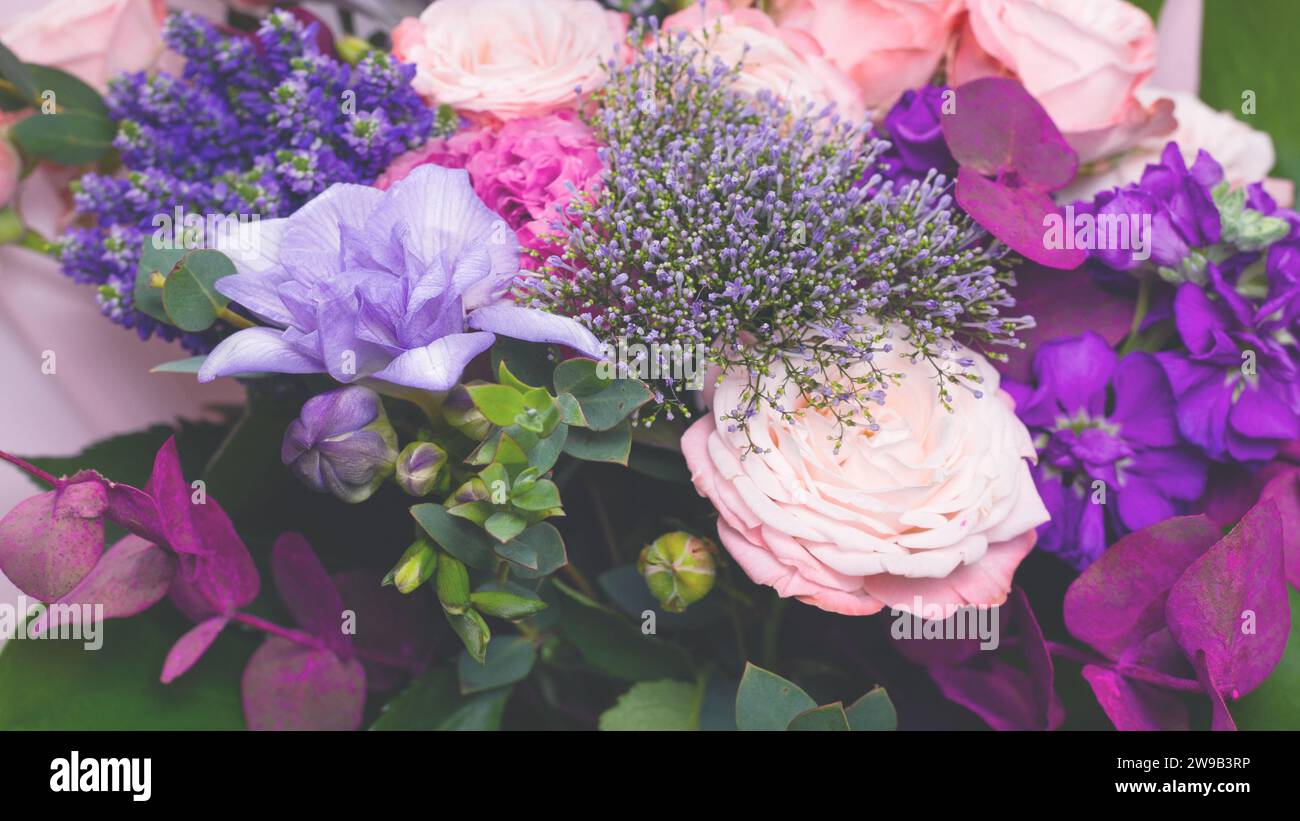 Bouquet of soft pink flowers in pink wrapping paper Stock Photo - Alamy