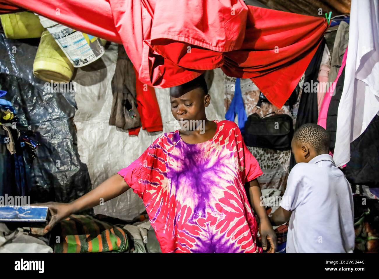 Lilian Atieno (L) and her daughter Whitney Lubanga seen at their house ...