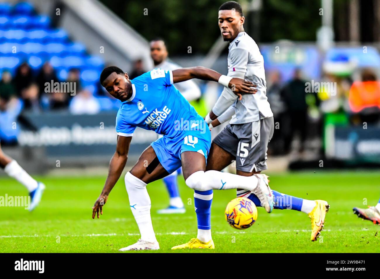 Ephron Mason Clarke (10 Peterborough United) challenged by Kevin ...