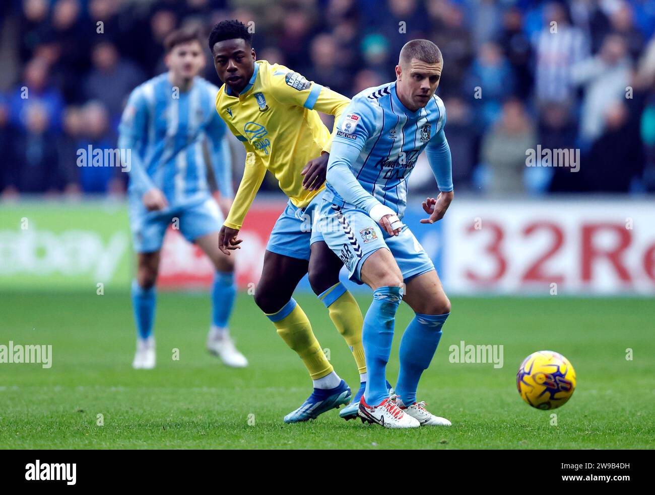 Coventry City's Jake Bidwell (right) and Sheffield Wednesday's Anthony ...