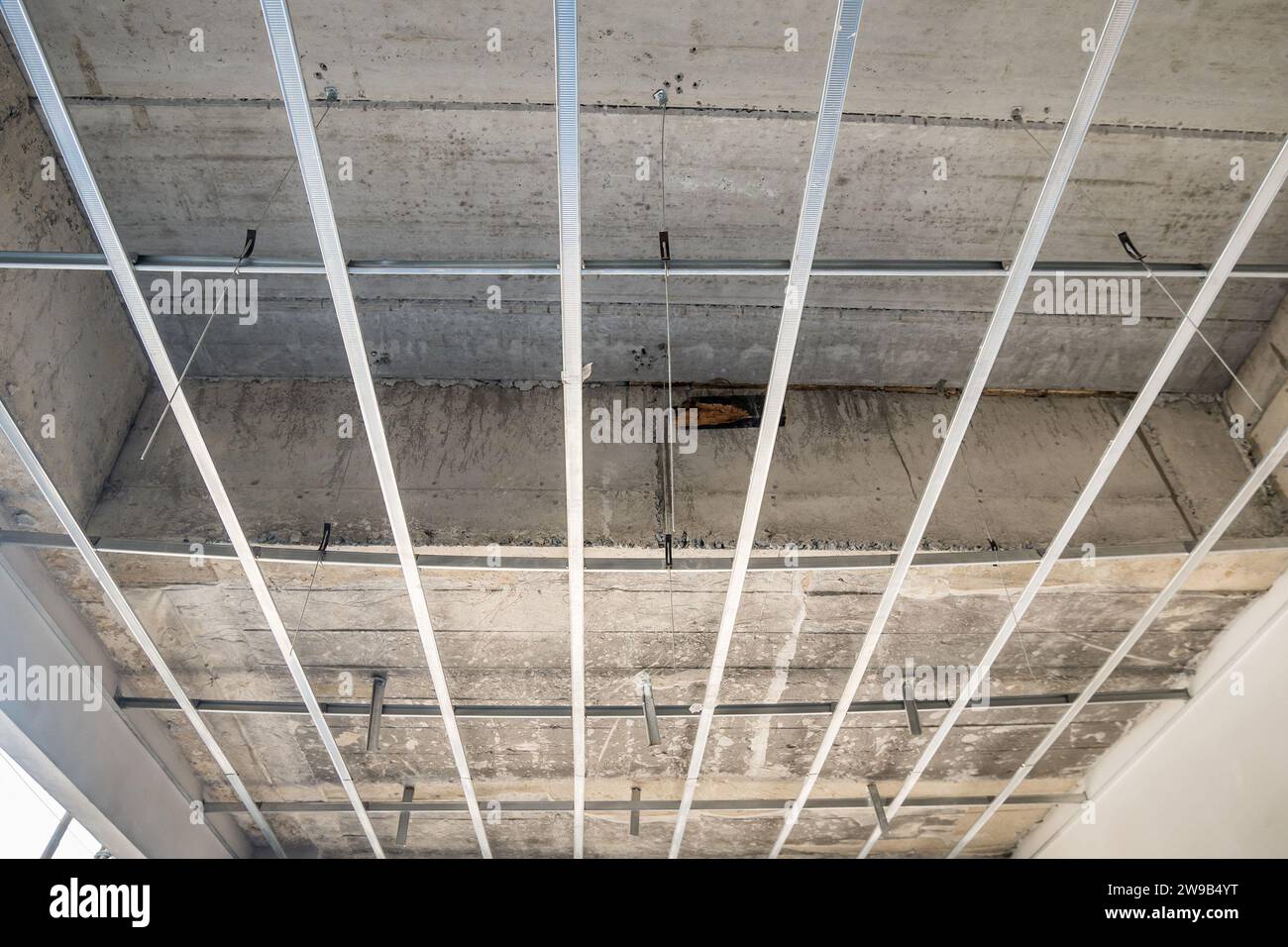 Install metal frame for plaster board ceiling at house under ...