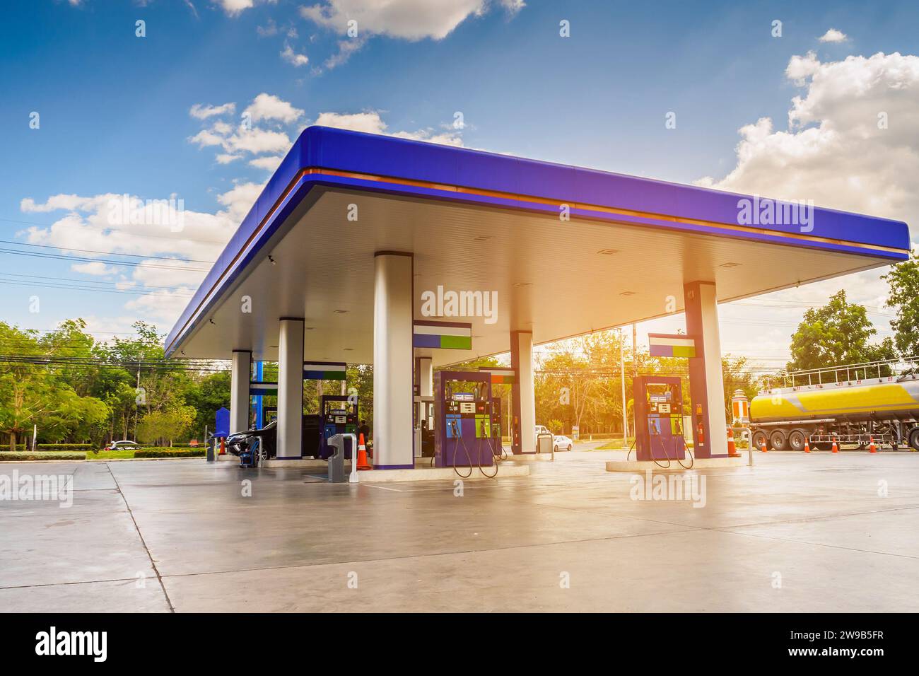 Gas station with clouds sky and sun light Stock Photo - Alamy