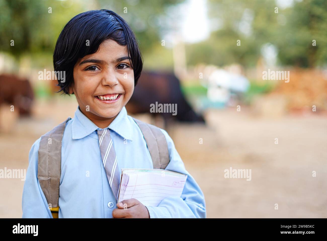 Kid, smile and portrait of student with books for education, study or ...