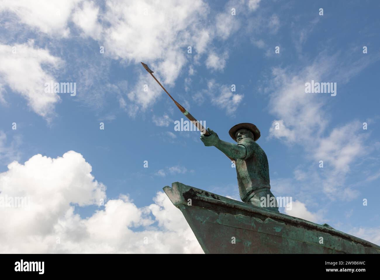 Statue of a whaler with a harpoon in front of the whale museum, Pico ...