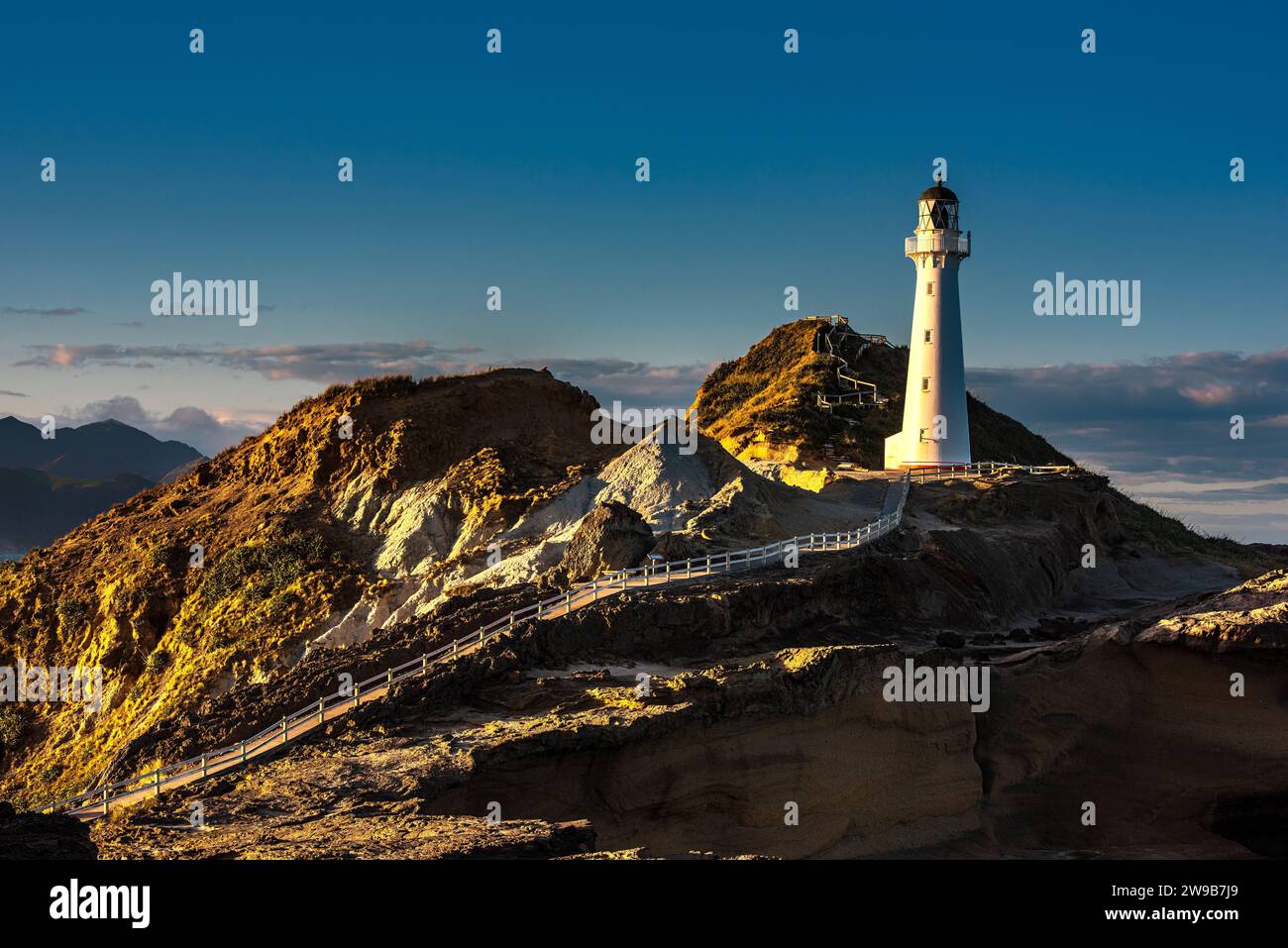 A lighthouse on top of a mountain with a sky background, Castlepoint ...