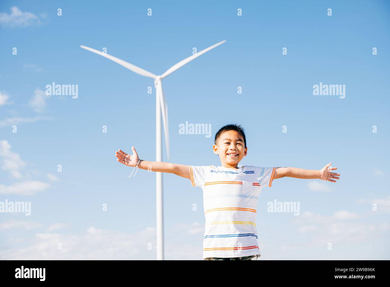 Smiling boy holding wind hi-res stock photography and images - Alamy