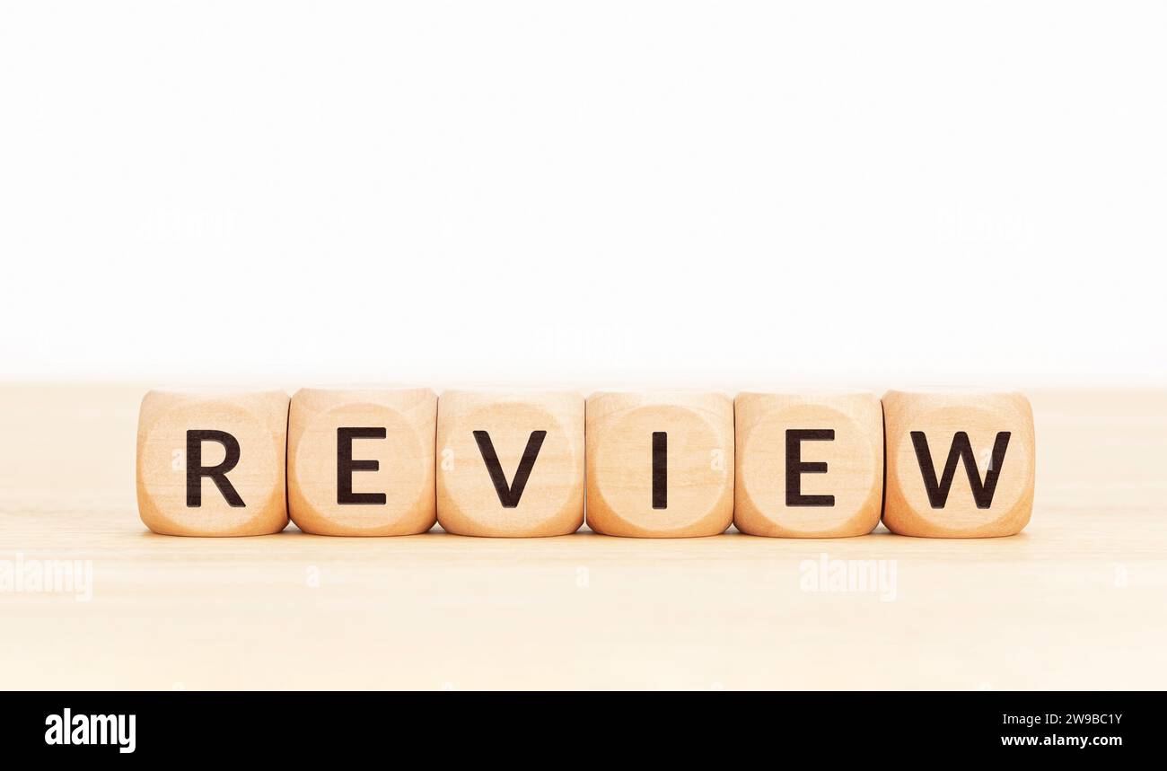 Review word on wooden blocks on white background. Copy space Stock ...