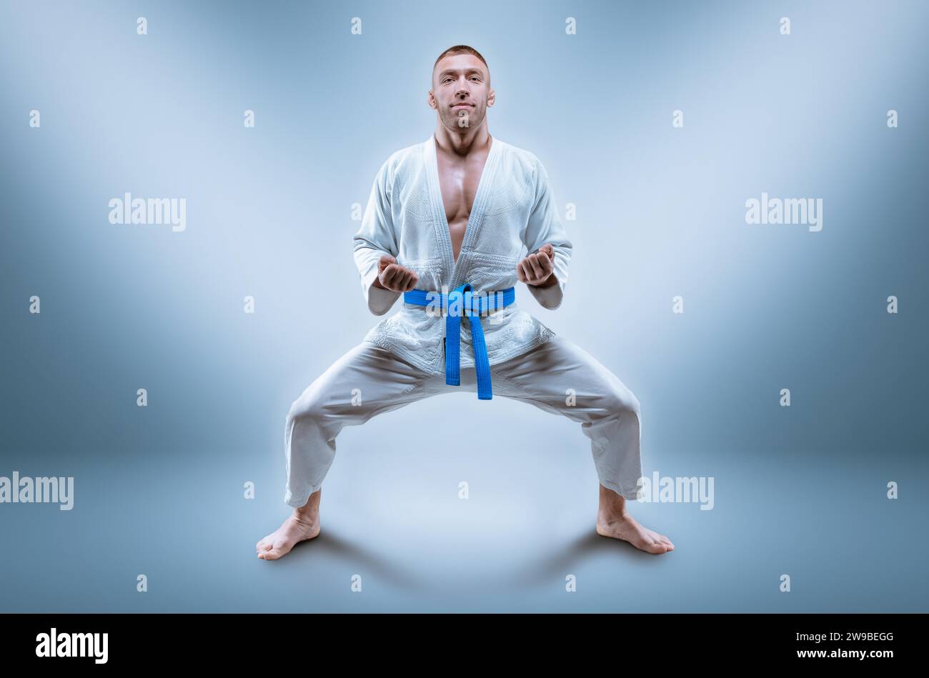 Professional wrestler is wearing a kimono. He is preparing to ...