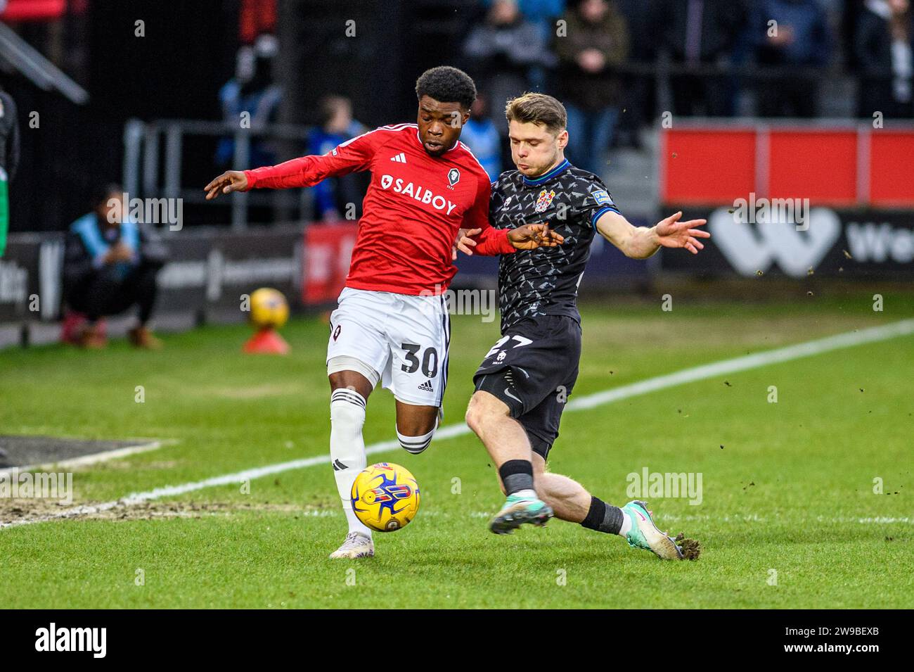 Tranmere Rovers' Connor Wood tackles Salford City's Kelly N'Mai during ...