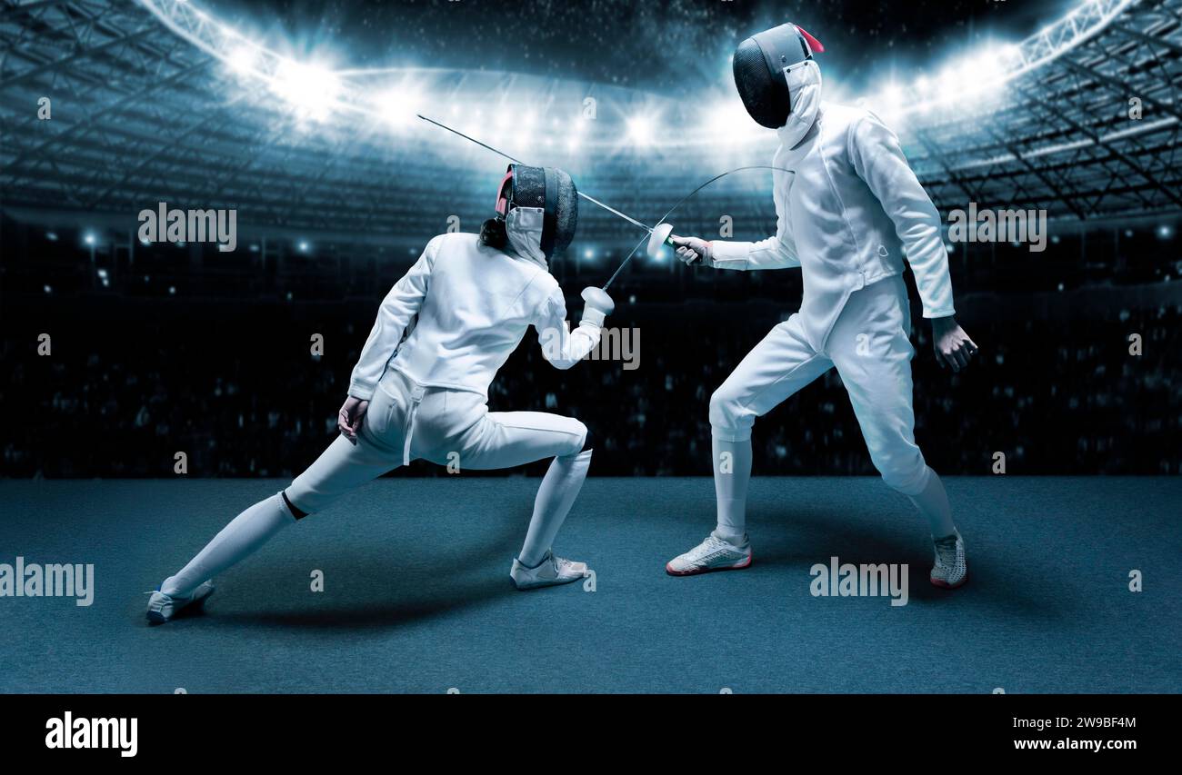 Portrait of two fencers against the backdrop of a sports arena. The ...