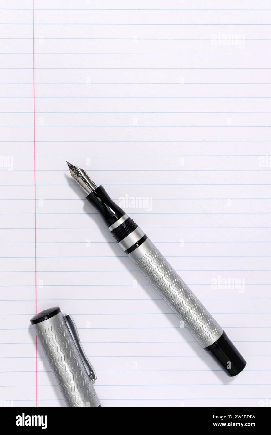 Fountain pen on blank lined paper background with Copy space Stock ...