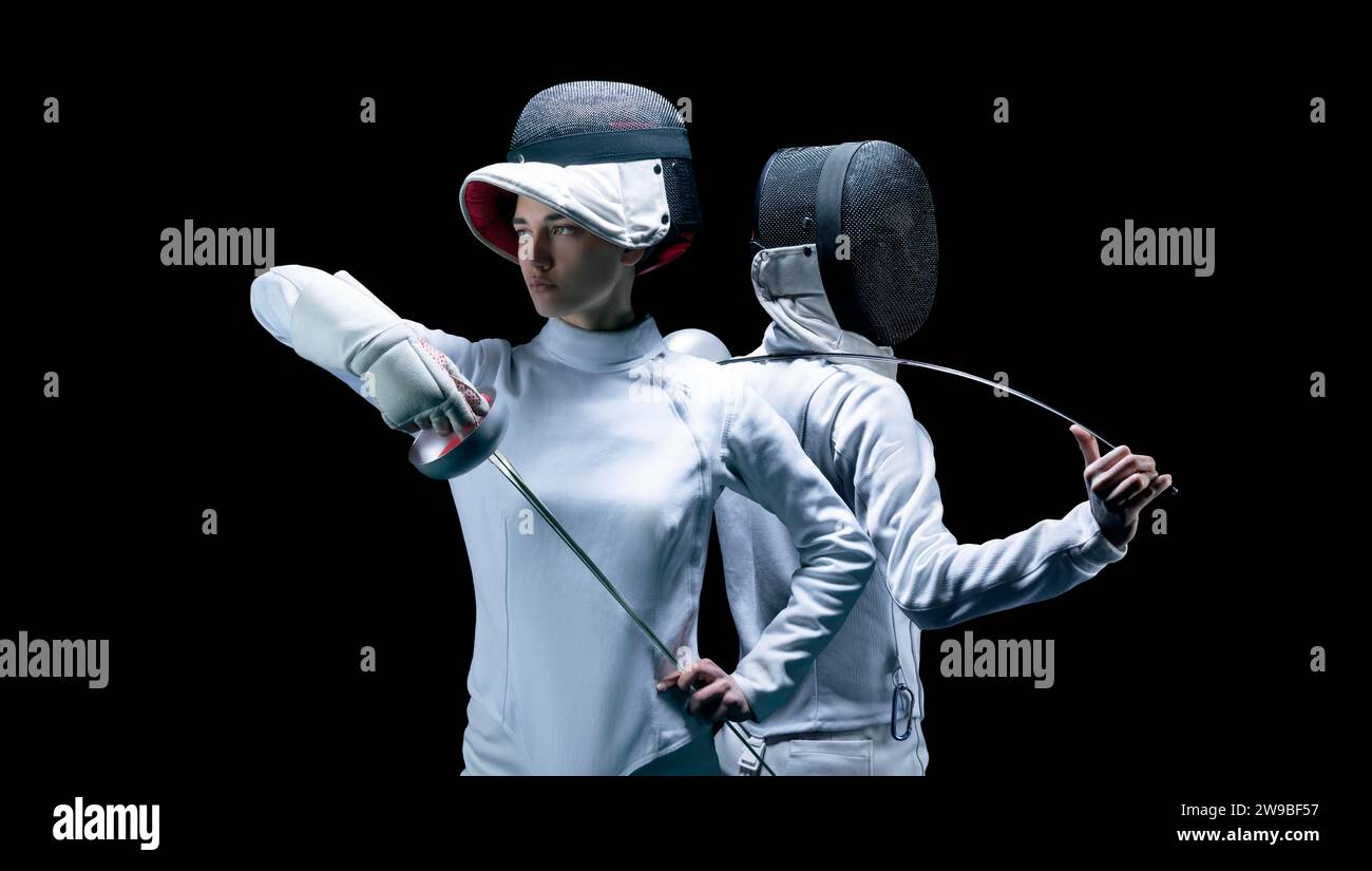 Portrait of two fencers on a black background. The concept of fencing ...
