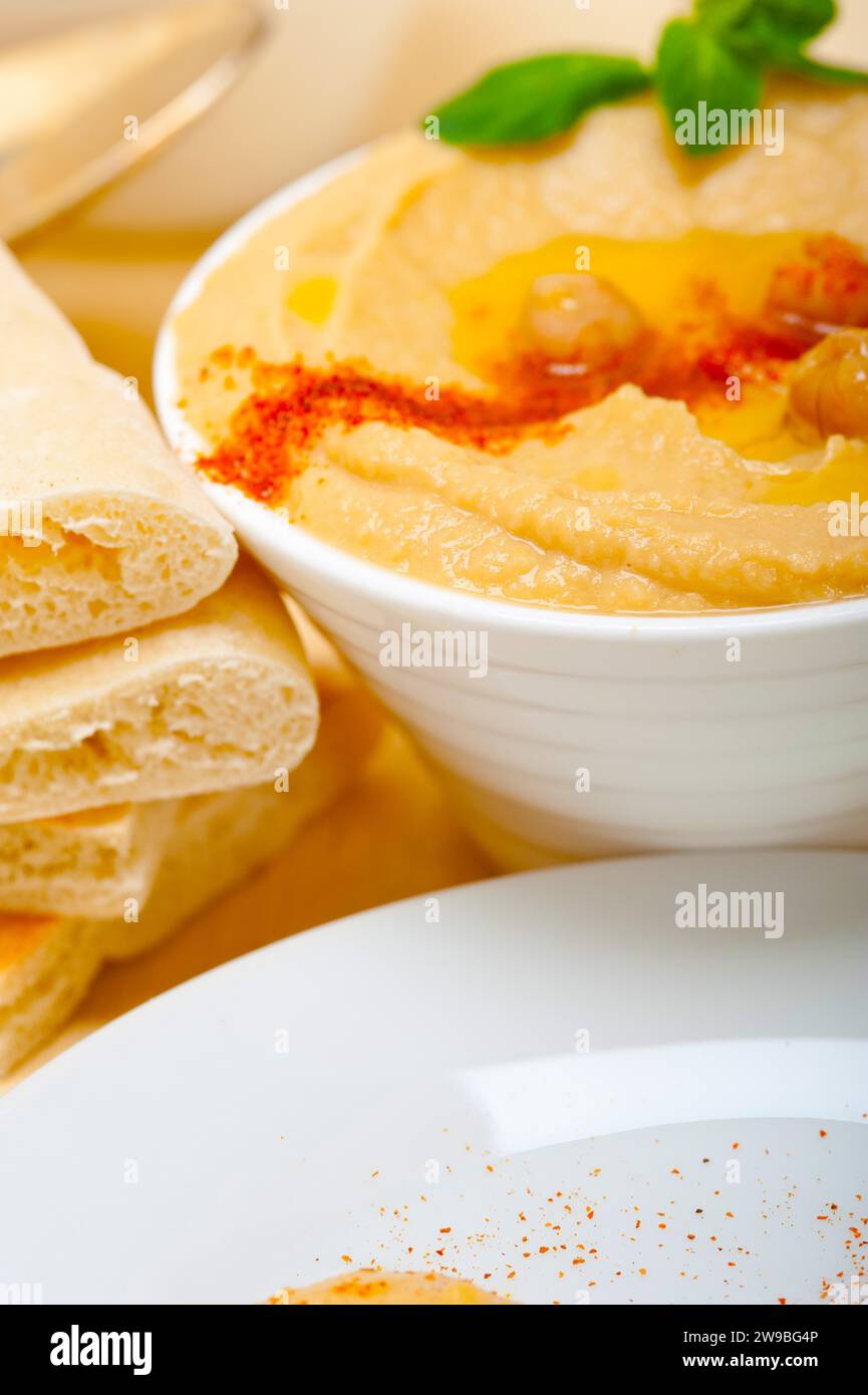 Traditional chickpeas Hummus with pita bread and paprika on top, food ...