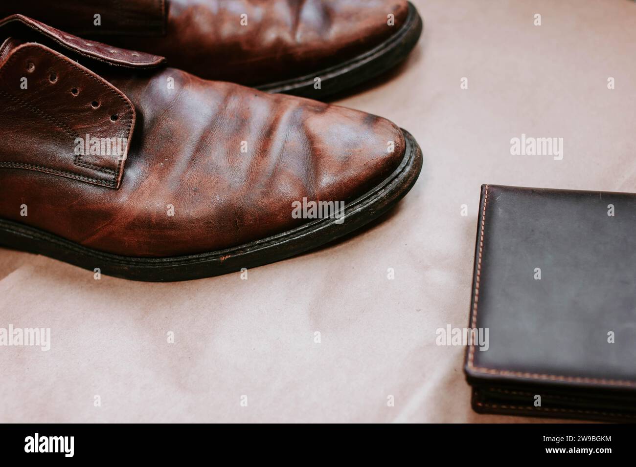 Brown men's shoes made of genuine leather and a brown leather wallet ...