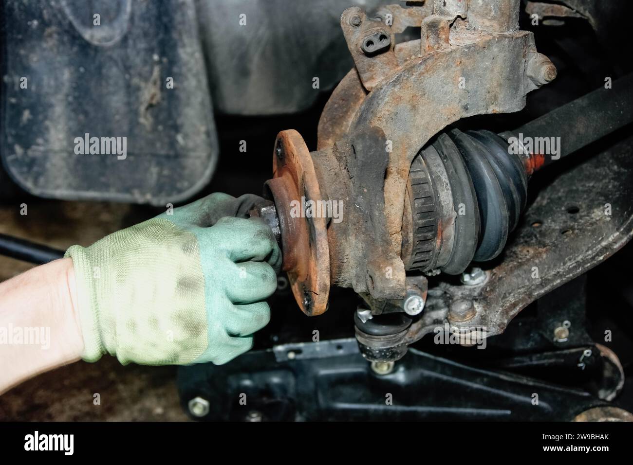 Car hub replacement, car repair, mechanic, glove, screws, motor ...