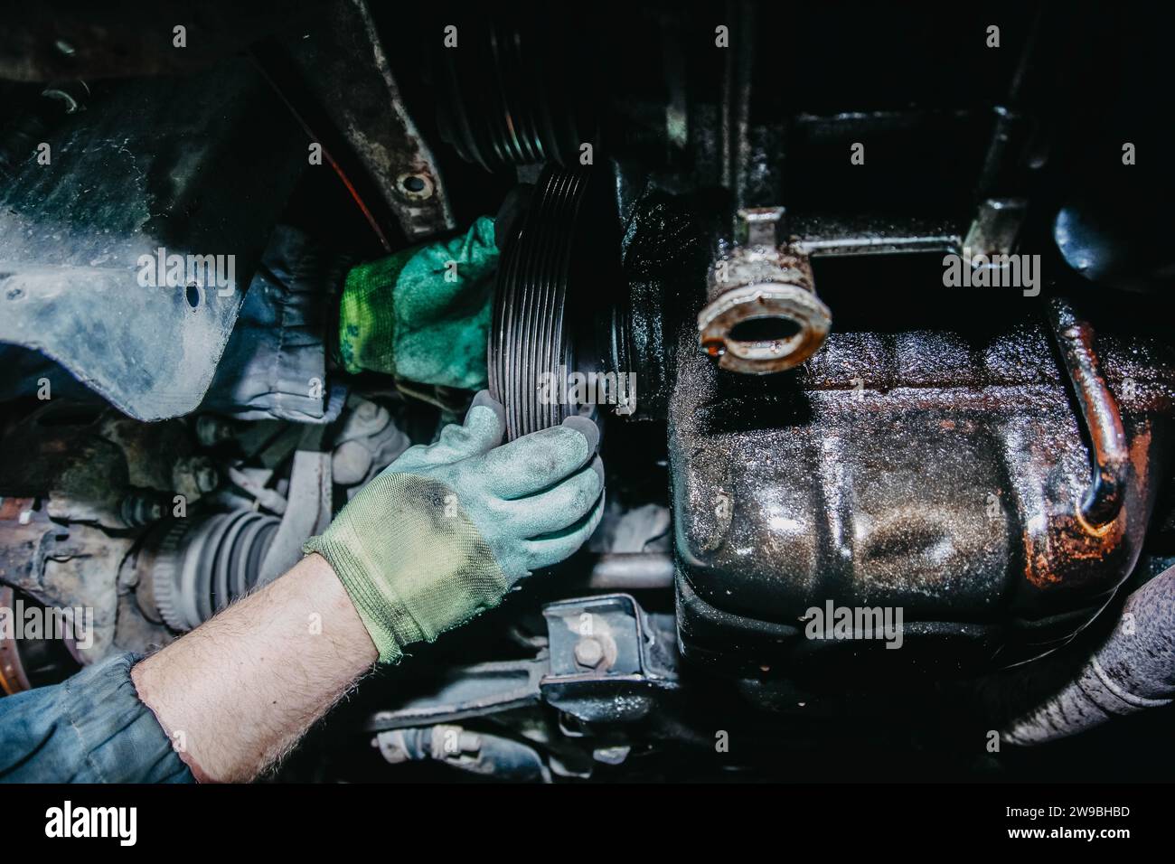 Car engine alternator belt replacement, car repair, mechanic, glove ...