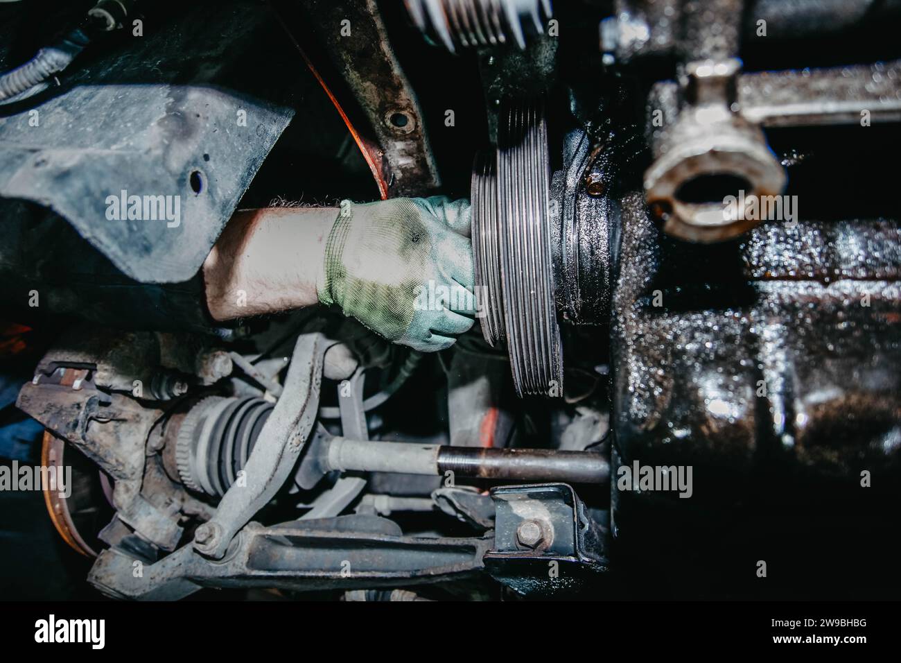 Car engine alternator belt replacement, car repair, mechanic, glove ...