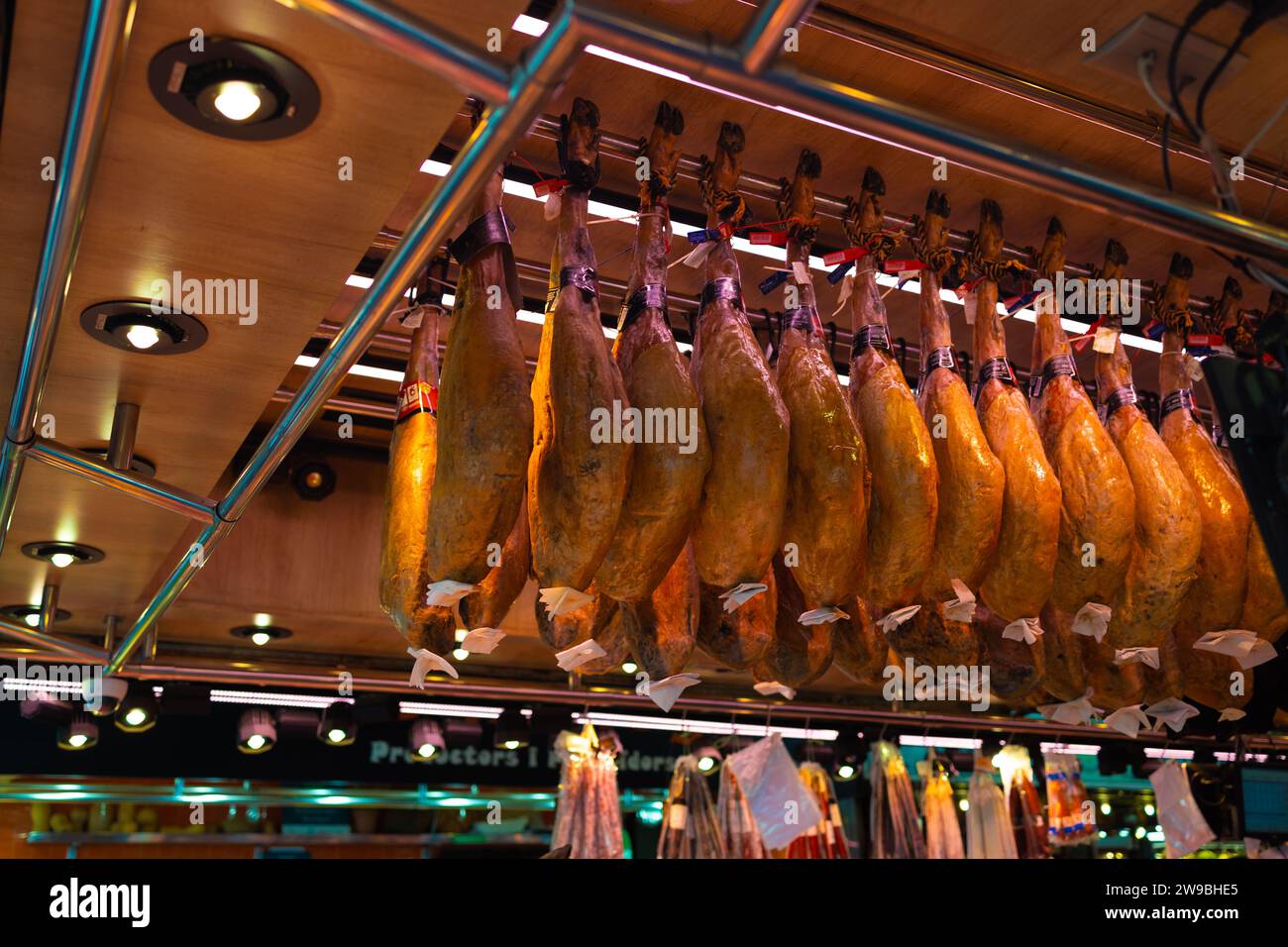 Traditional Spanish jamon ham for sale at the market on the La Boqueria ...