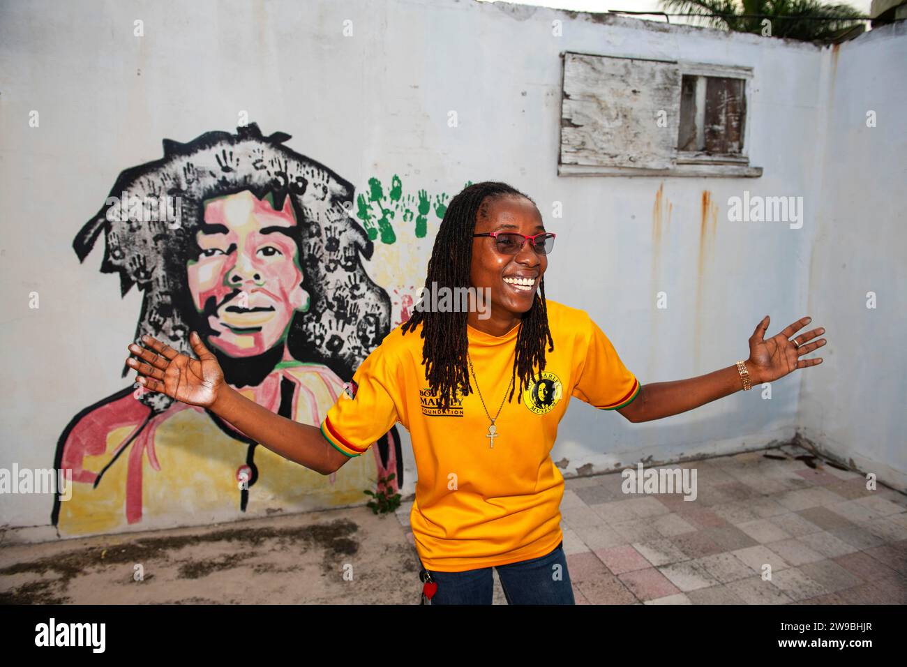 Tour guide Susan Maxwell in front of Bob Marley mural, Tuff Gong music ...