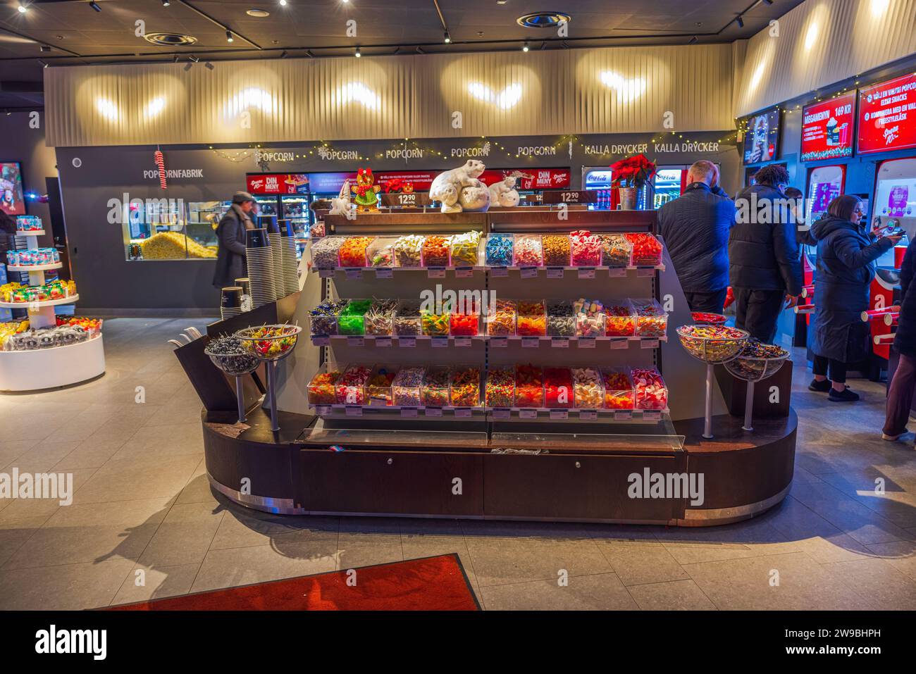 Beautiful view of cafe with people where shelves with vibrant sweets ...