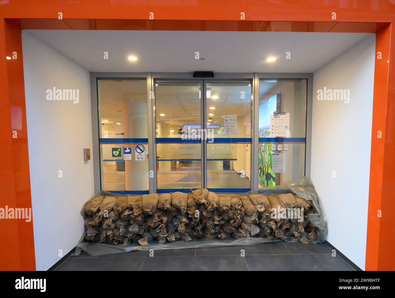 Sarstedt, Germany. 26th Dec, 2023. Sandbags secure a bank branch on the ...